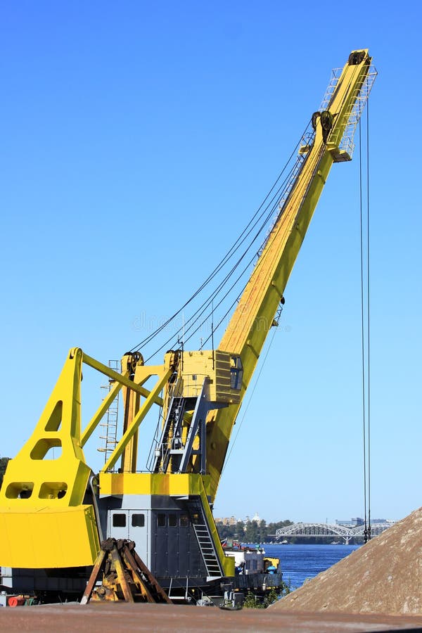 Quay Crane Discharging Shipping Container with Blue Sky Background ...