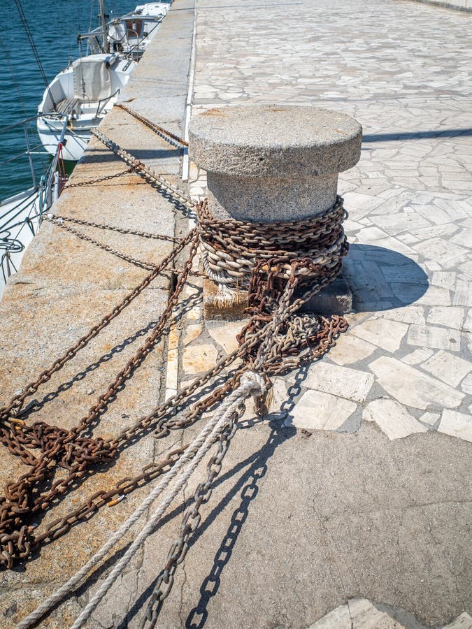 Quayside Capstan with Chains and Ropes Stock Photo - Image of quayside ...