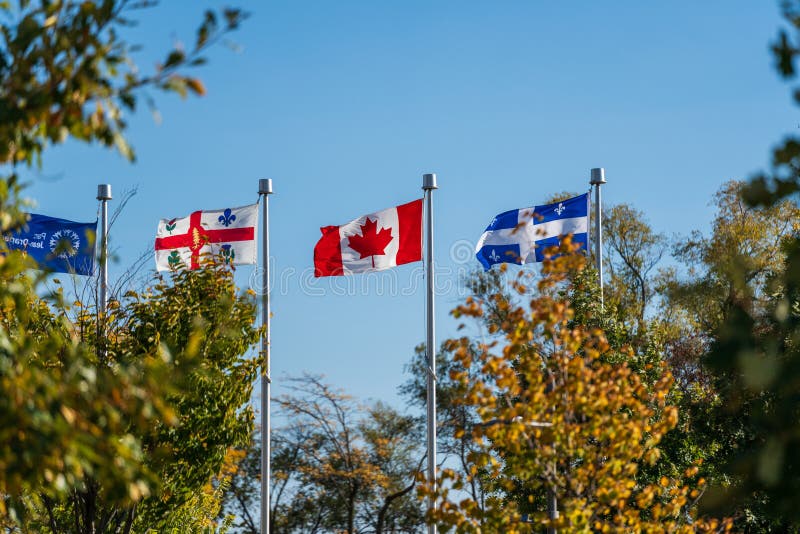 Quebec, Canada and Montreal Flags Waving. Montreal, Quebec, Canada ...