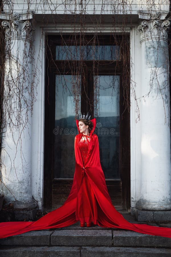 Queen in the red cloak stock image. Image of mantle, beauty - 37433421