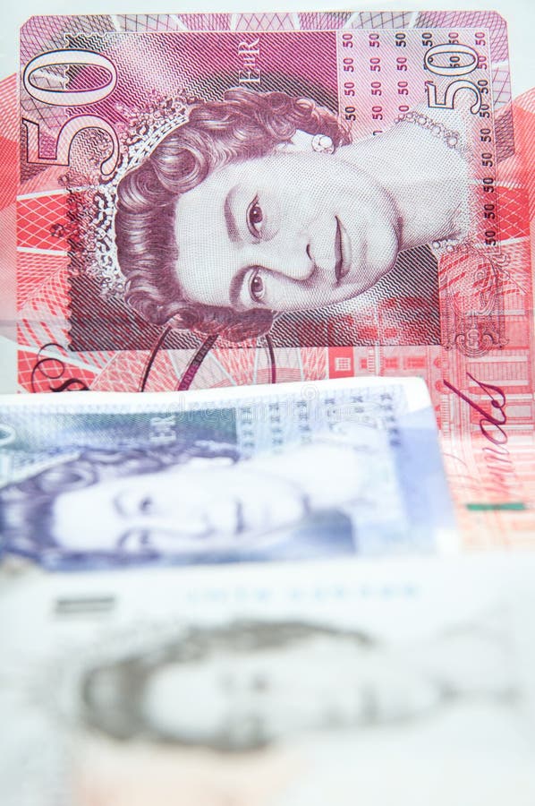 The Queens Face on an Old Pound Note Looks Out from within a Triangle ...