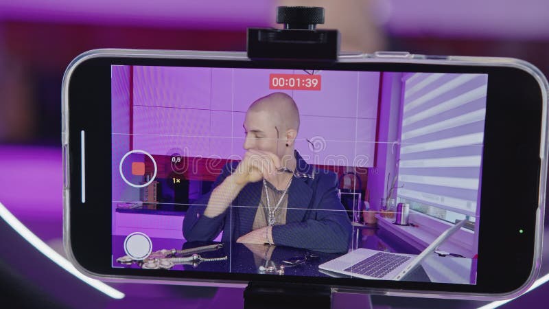 Non-binary Person Creates a Vlog with Smartphone, Shopping Haul, Non ...