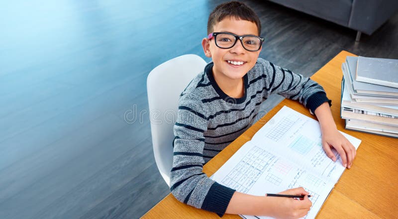On the Quest for Knowledge. Portrait of a Determined Young Boy Doing ...