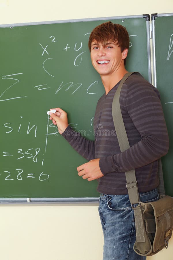 Teacher Holding Text Book Pointing To Student Stock Image - Image of ...