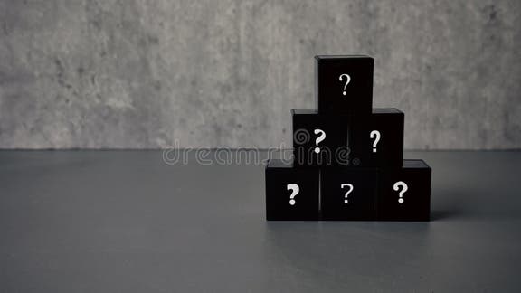 Question and Answer Concept. Stack of Black Cube with a Symbol of ...
