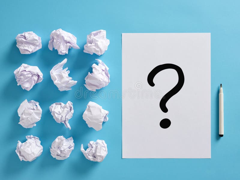 Question Mark Icon on a Paper Sheet with Crumpled Paper Balls and a Pen ...