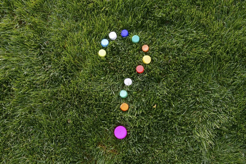 Question Mark Made with Colorful Bottle Caps on the Grass Stock Image ...