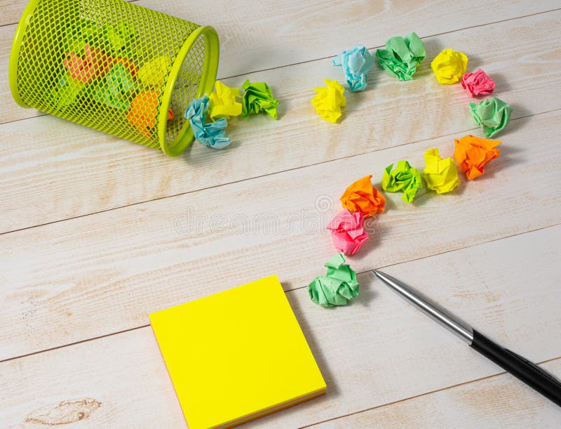 Question Mark Made of Crumpled Note Paper on a Wooden Writing Table ...