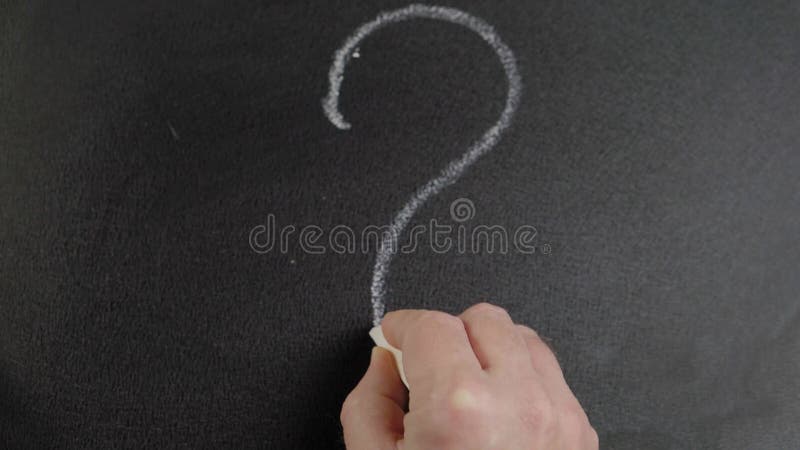 Question Mark. Man Hand Writes the Question Mark by Chalk on a ...