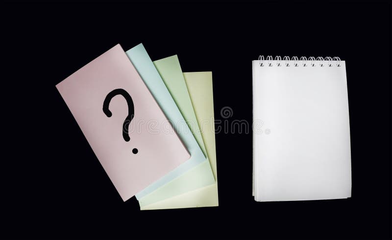 Question Mark on a Sticky Note, Next To a Notepad for Writing.Desk ...
