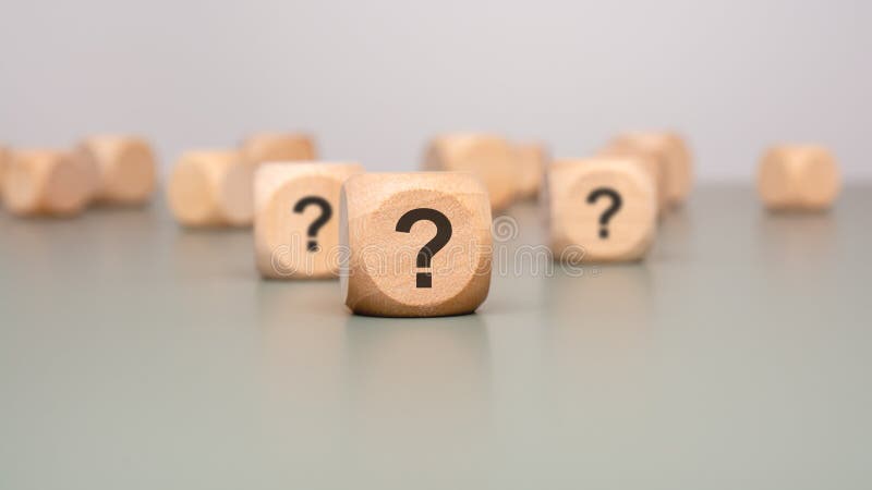 Question Marks on Wooden Blocks Symbolize the Concept of Uncertainty in ...