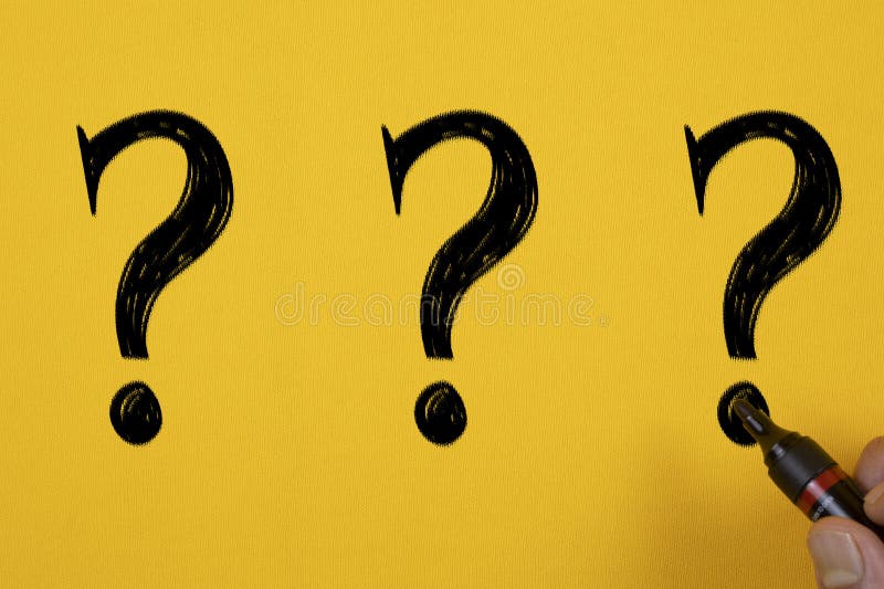 Question Marks Written on Yellow Background. Hand with Pen Highlighter ...