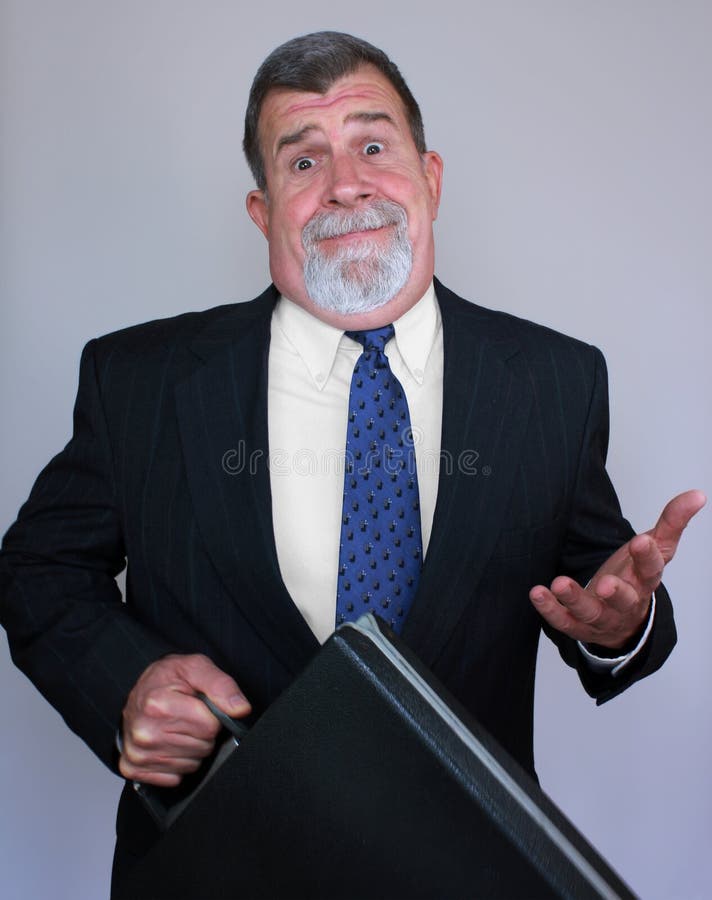 Questioning Businessman with Briefcase Stock Photo - Image of ...