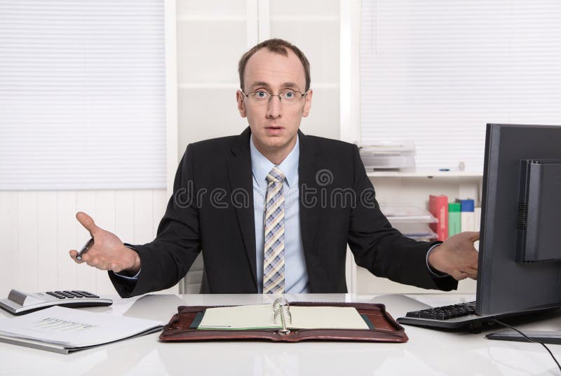Questioningly Bald Engineer or Specialist Sitting at Desk. Stock Image ...