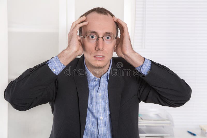 Questioningly Bald Engineer or Specialist Sitting at Desk. Stock Image ...