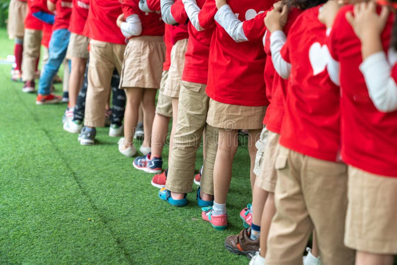 Queue of Asian Kids in School Uniform Standing in Line Stock Photo ...