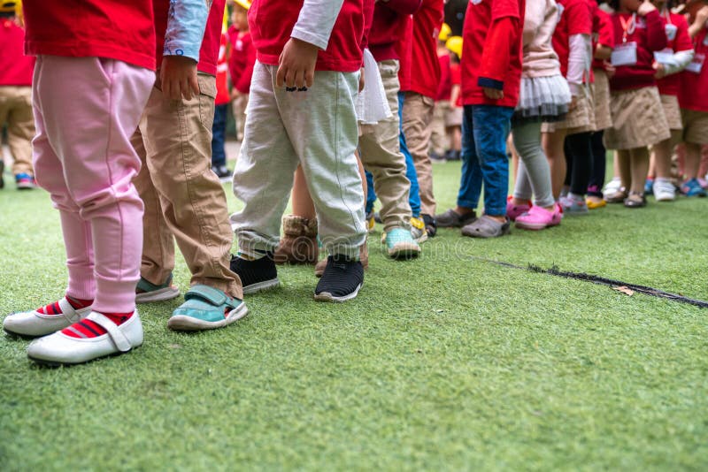 Queue of Asian Kids in School Uniform Standing in Line Stock Photo ...