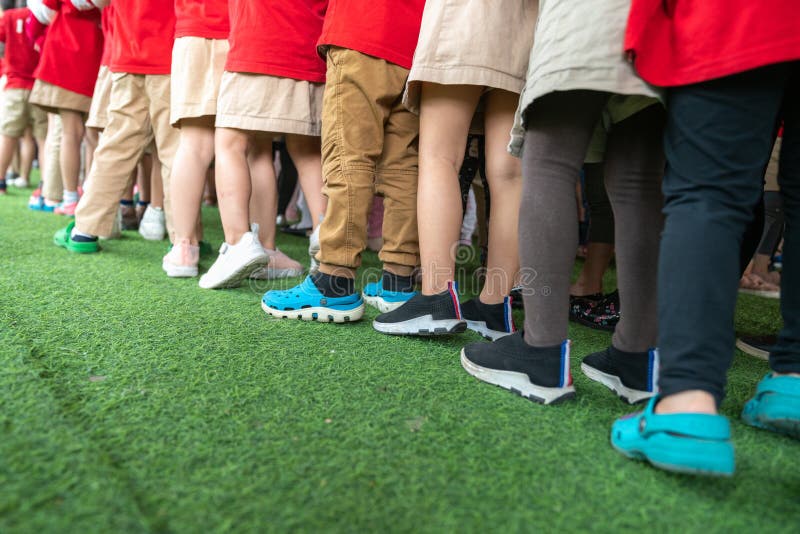 Queue of Asian Kids in School Uniform Standing in Line Stock Photo ...