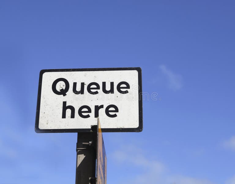 Queue here stock photo. Image of signage, waiting, wait - 20561054