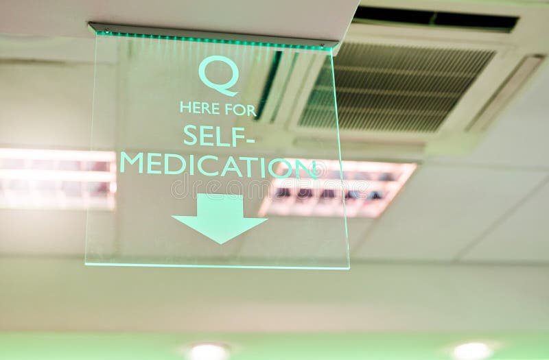Queue Here for Your Wellbeing. a Self-medication Sign in a Pharmacy ...