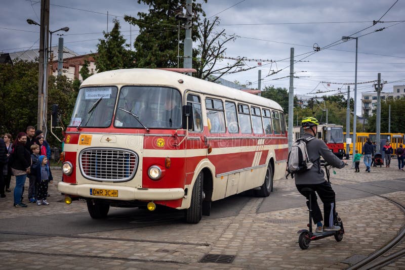 A Queue of Passengers Getting into Vintage Red and Cream Skoda Bus ...