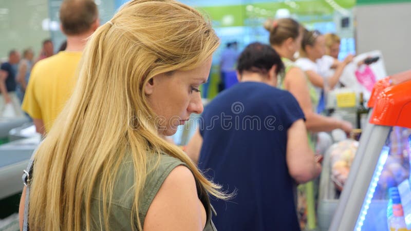 The Queue of People Standing at the Checkout in the Supermarket. 4k ...