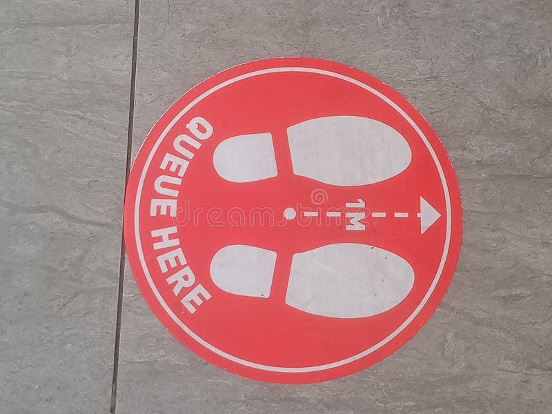 Queue sign on the floor stock image. Image of malaysia - 235152561