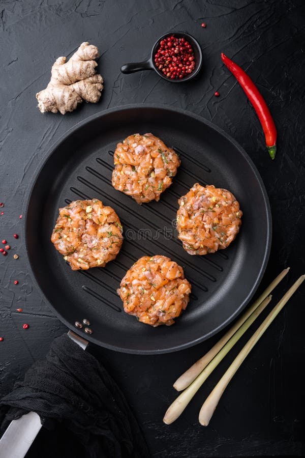 Quick Asian Raw Fishcakes, on Black Textured Background, Top View Stock ...