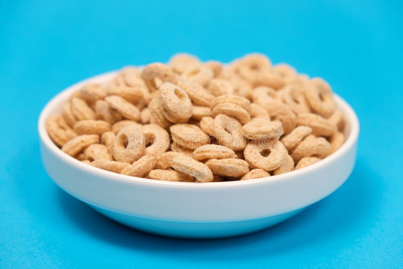 Quick Cereal Breakfast in the Form of Rings on a Plate on a Blue ...