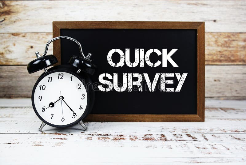 Quick Survey Text Message and Alarm Clock on Wooden Background Stock ...