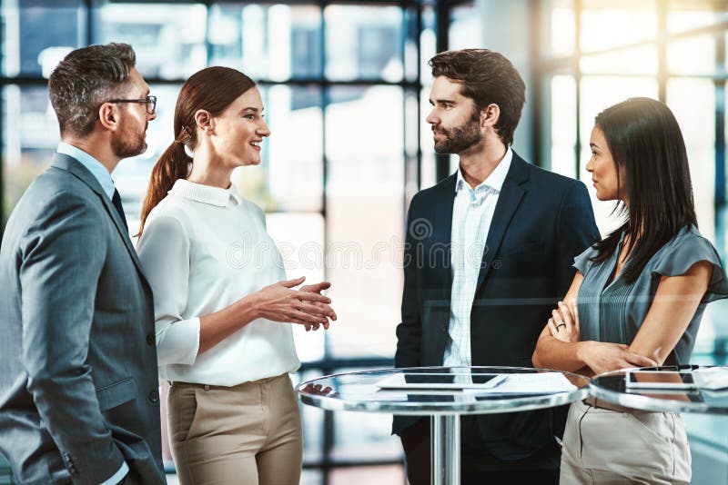 Quick Update Guys...a Group of Colleagues Having a Discussion in a ...