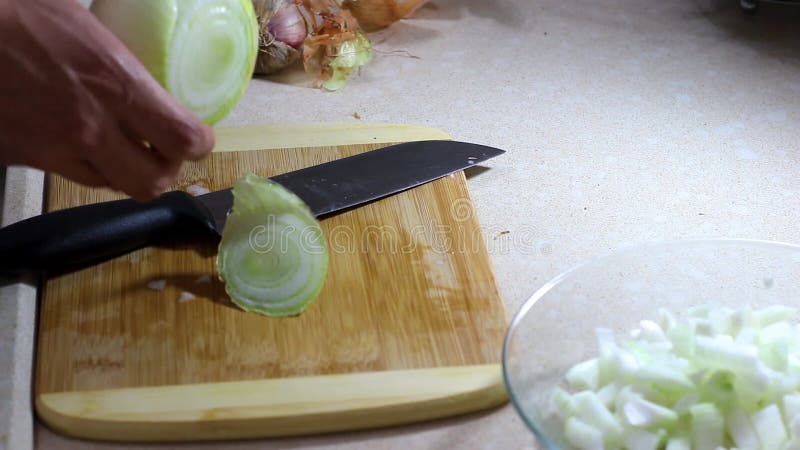 A Quick Video of a Man Cutting an Onion into Small Pieces Stock Footage ...