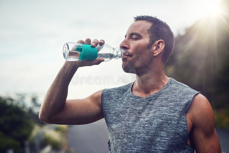 Quick Water Break before Running Again. a Young Handsome Man Training ...