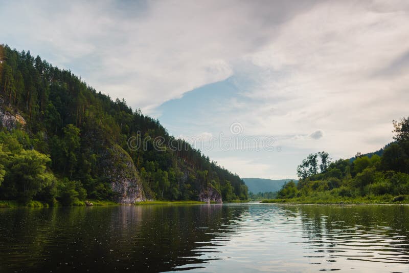 Quiet River between Mountains and Hills Overgrown with Coniferous ...
