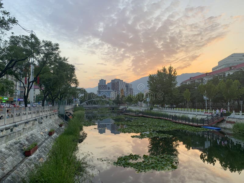 The Quiet River Reflects the Clouds in the Sky and the Trees on the ...