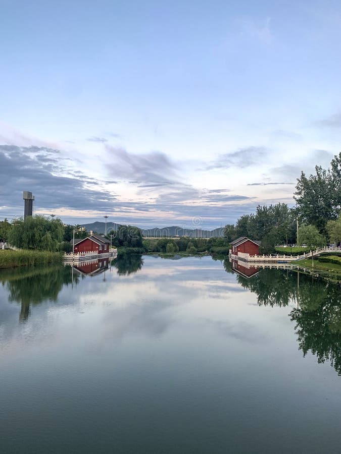 The Quiet River Reflects the Clouds in the Sky and the Trees on the ...