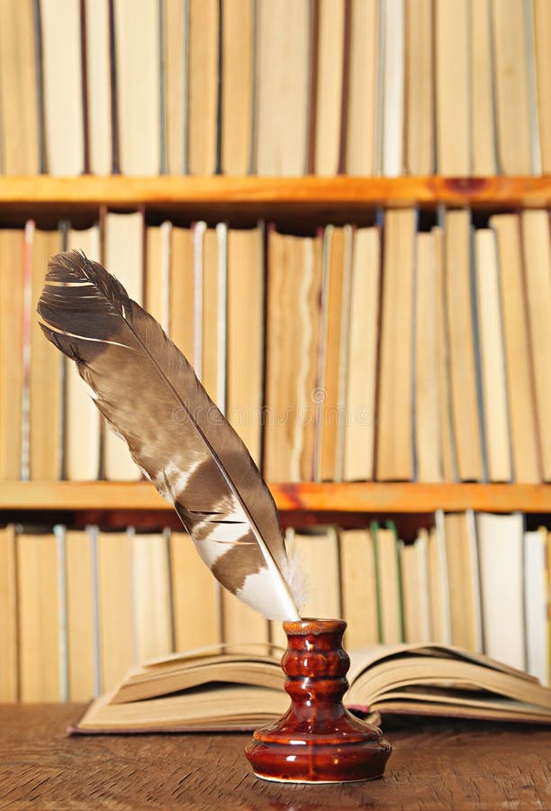 Quill Pen on an Old Book in a Library Stock Image - Image of bookshelf ...