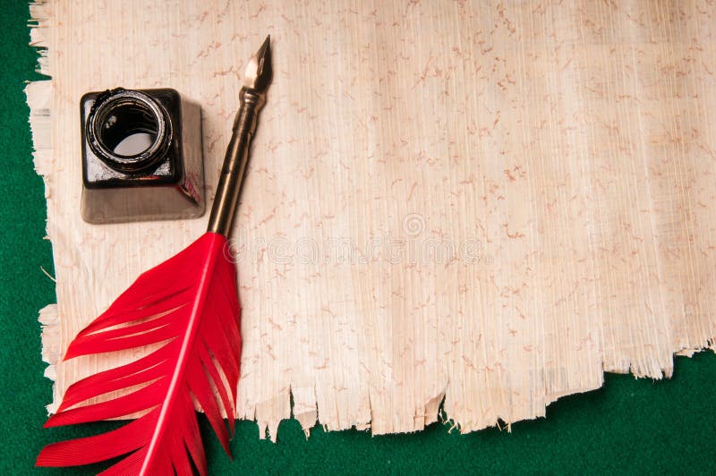 Quill pen on papyrus paper stock photo. Image of retro - 61937374