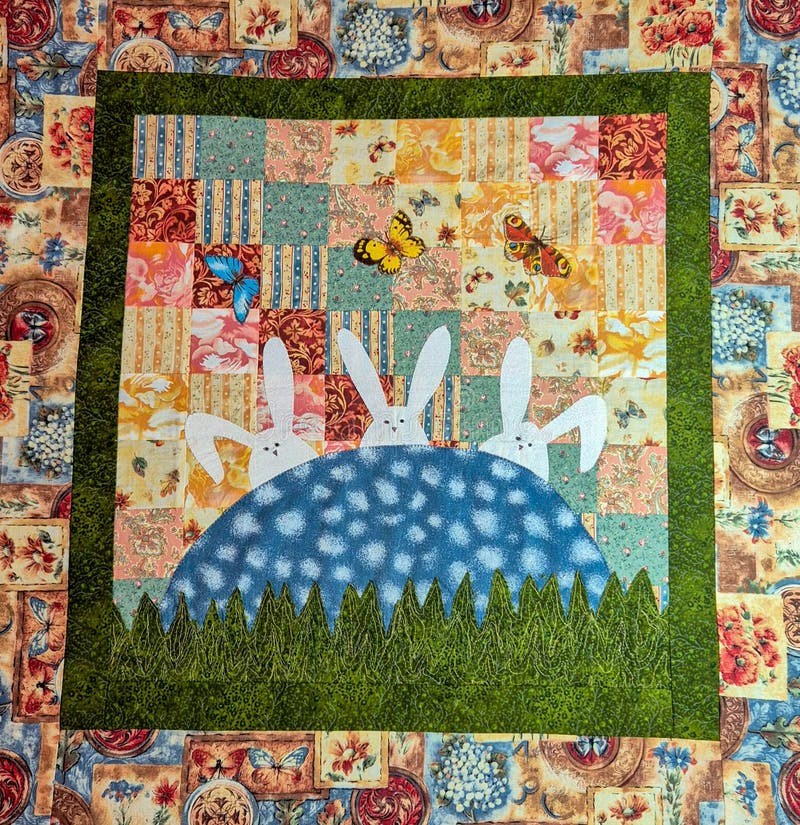 Quilted Art Piecing Featuring Therrew White Rabbits. Stock Photo ...