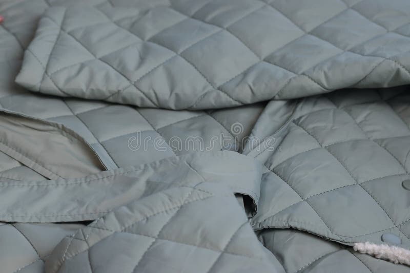 Quilted Long Jacket. Lying on the Table Stock Image - Image of stylish ...