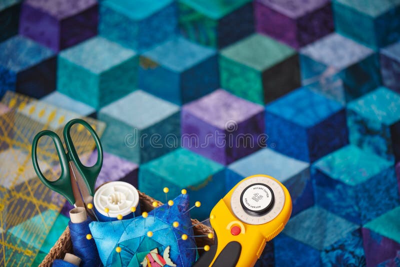 Quilting Accessories on the Background of a Tumbling Blocks Quilt Stock ...
