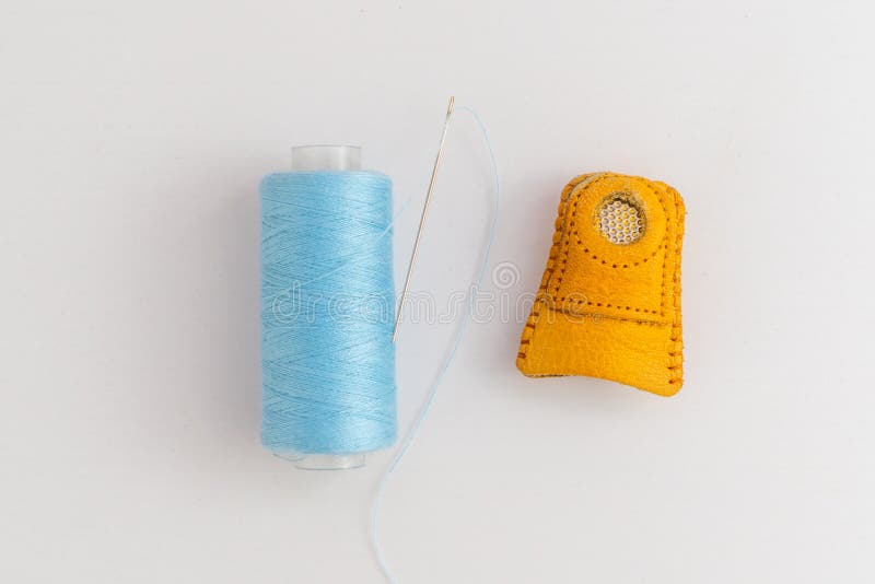 Quilting Essentials: Sewing Thread, Needle and Leather Thimble Stock ...