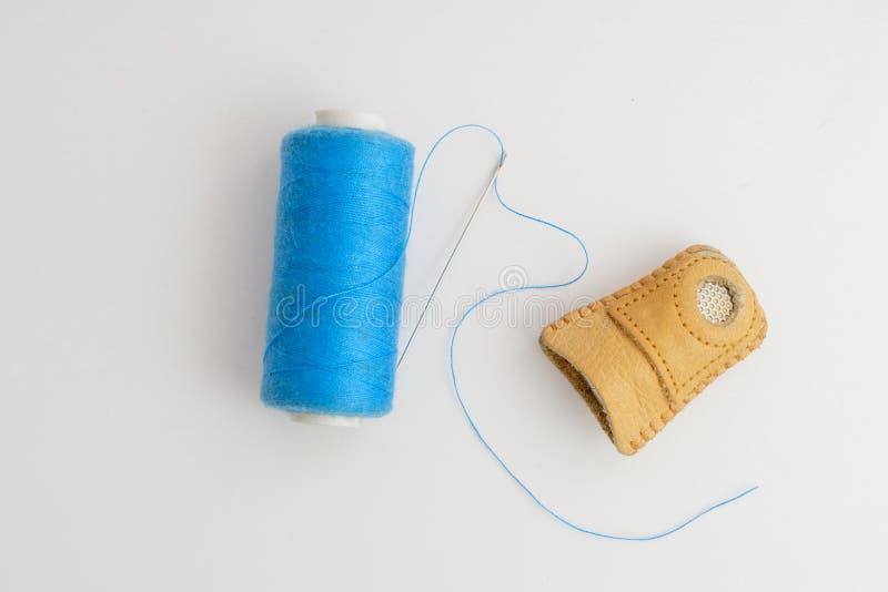 Quilting Essentials: Sewing Thread, Needle and Leather Thimble Stock ...