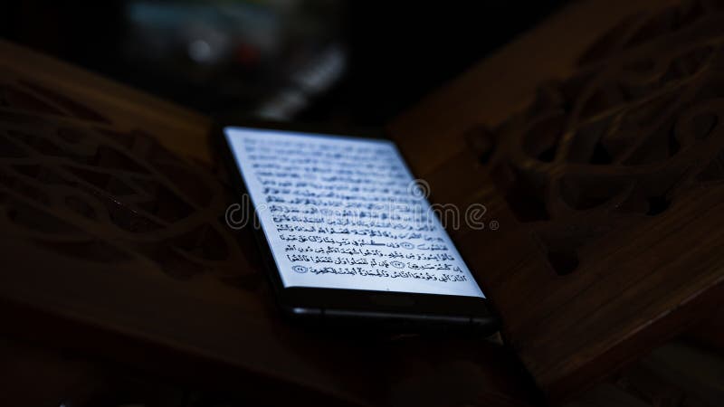 Quran in Smart Phone Apps on Wooden Book Stand Editorial Stock Image ...