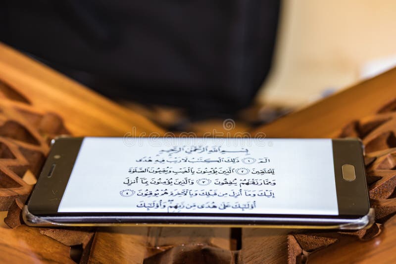Quran in Smart Phone Apps on Wooden Book Stand Editorial Image - Image ...
