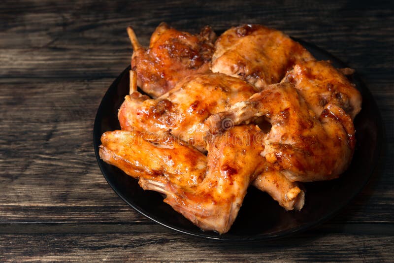 The Rabbit Baked in an Oven in Red Sauce Stock Photo - Image of ...