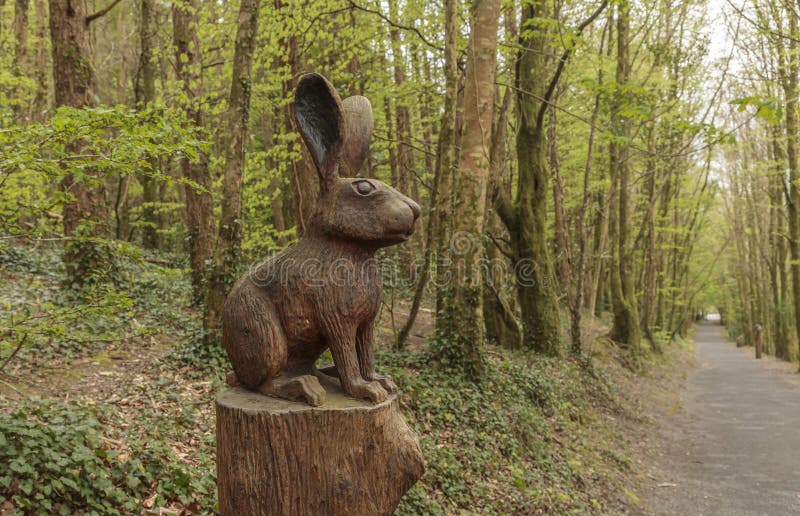 Rabbit Carved Out of a Tree Stump in the Forest Editorial Photography ...
