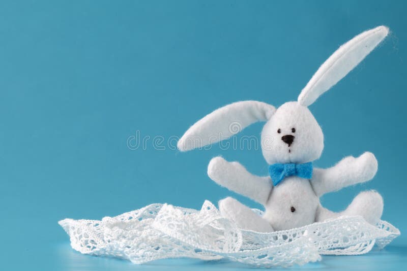 Rabbit Doll in Blue Background Stock Photo - Image of decoration, cute ...