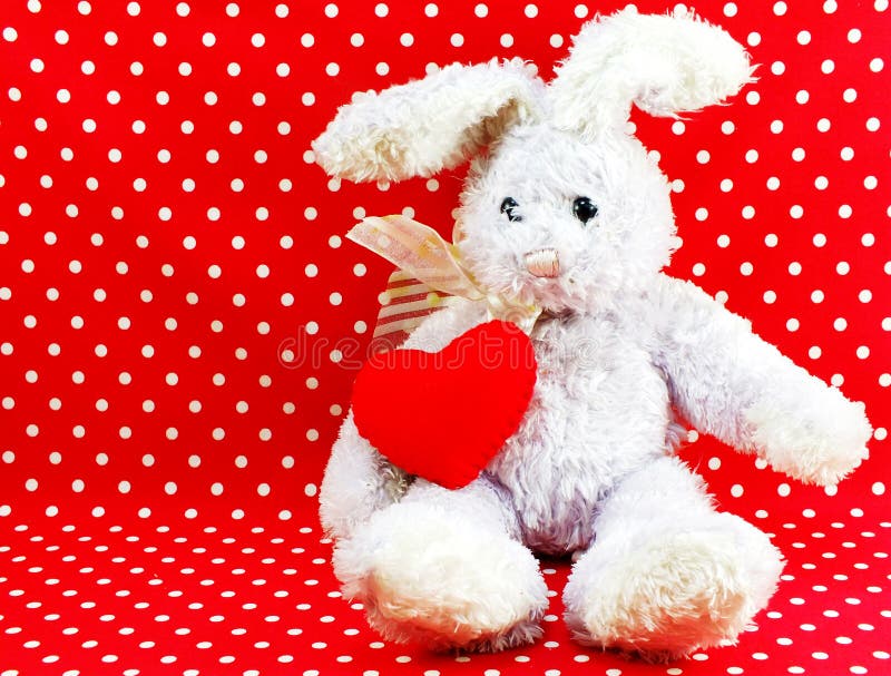 Rabbit Doll with Red Heart on Red Polka Dot Background Stock Image ...