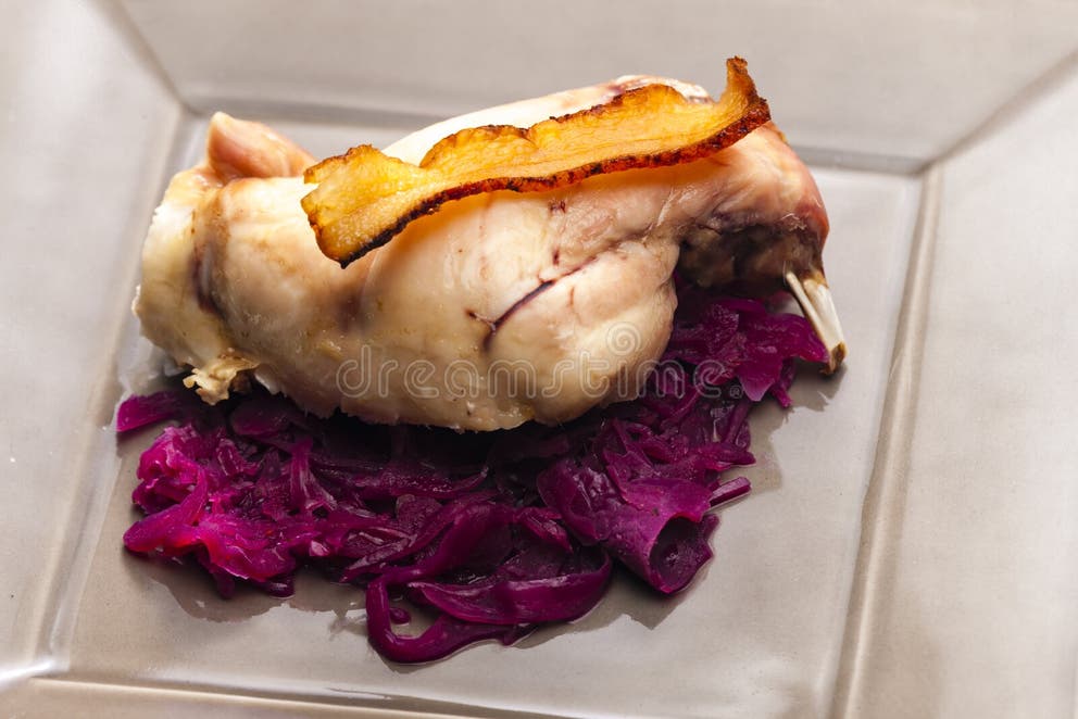 Rabbit Leg Baked with Bacon and Served with Red Cabbage Stock Photo ...